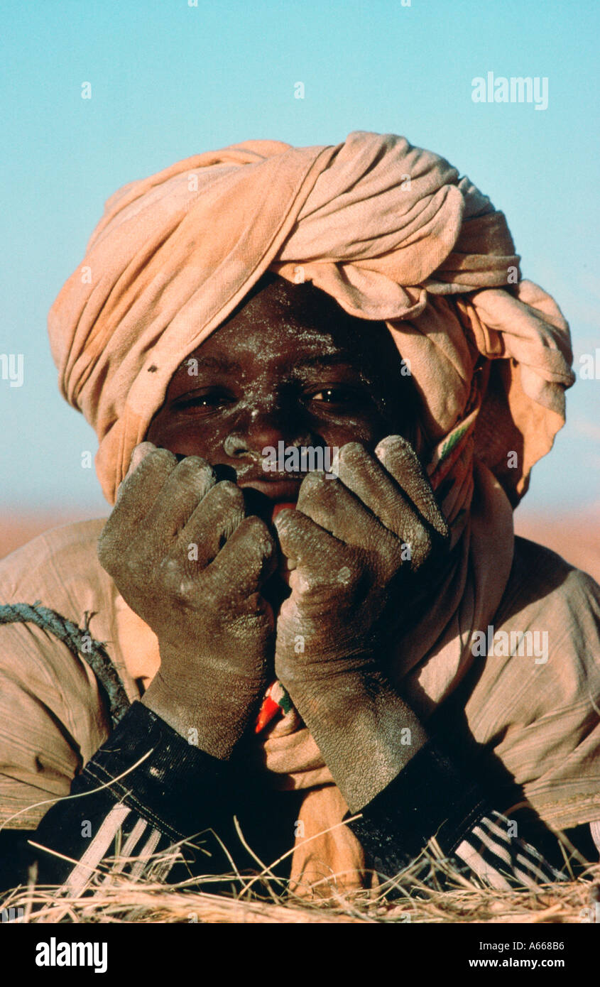 The salt scared hands and face of a Taoudenni salt miner Stock Photo ...