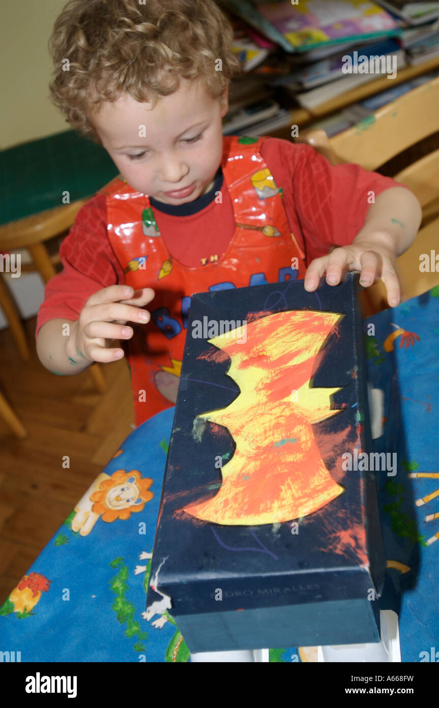 4 yr old boy building rocket Stock Photo - Alamy