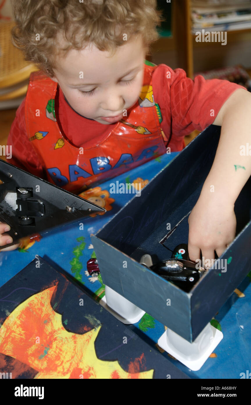 4 yr old boy building rocket Stock Photo - Alamy