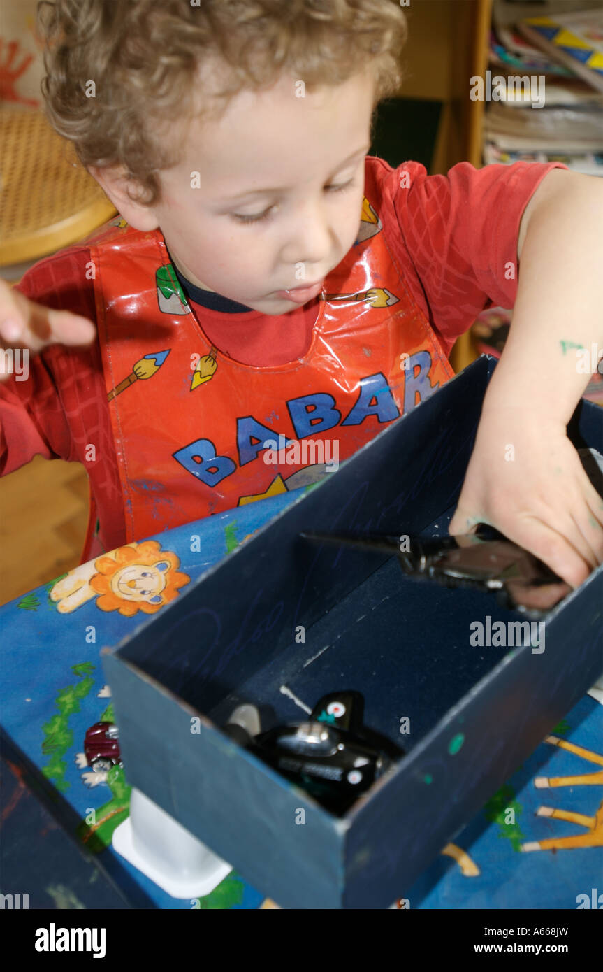 4 yr old boy building rocket Stock Photo - Alamy