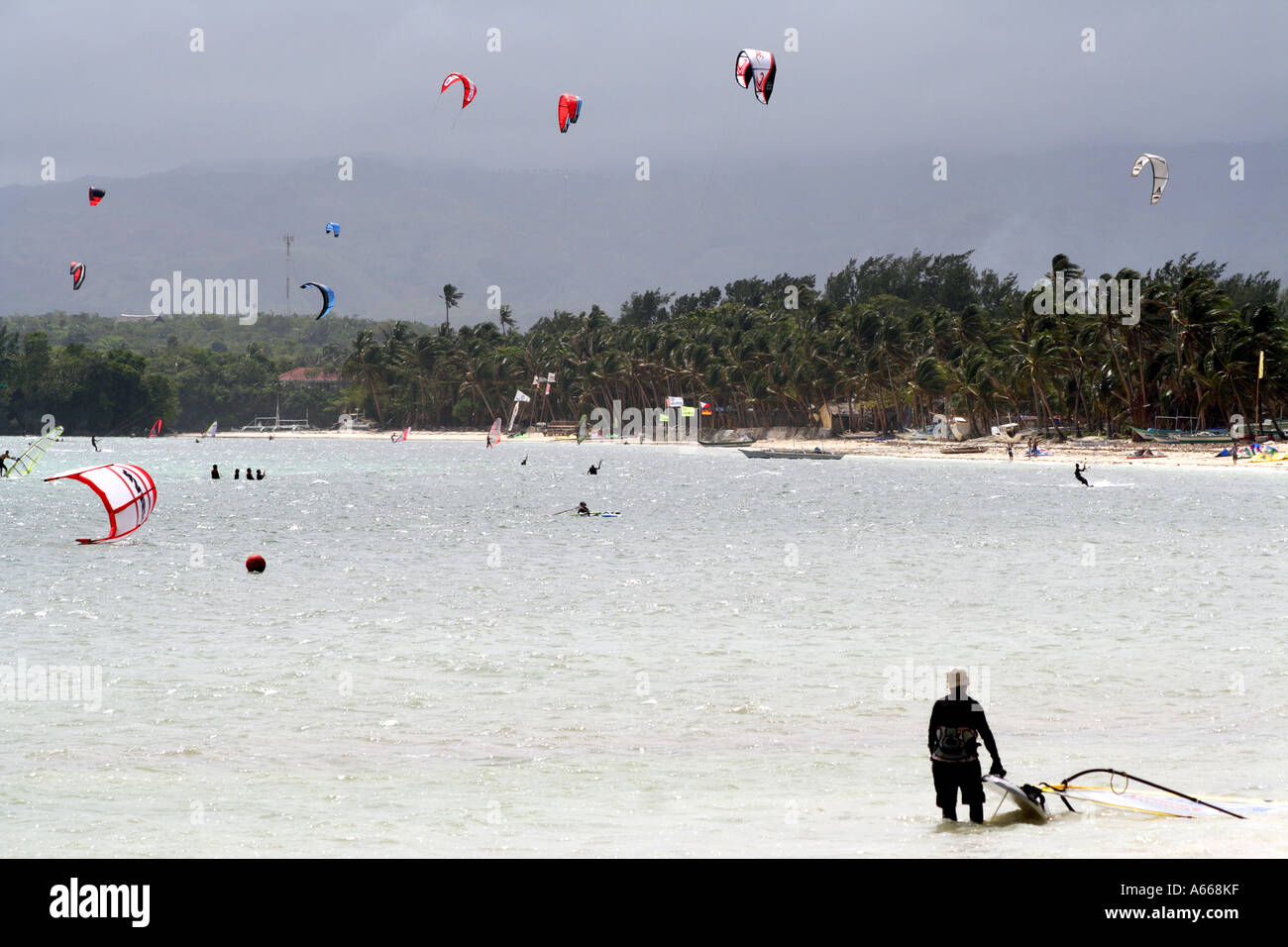 Parasurfing and windsurfing off of Boracay, White Beach, Philippine ...