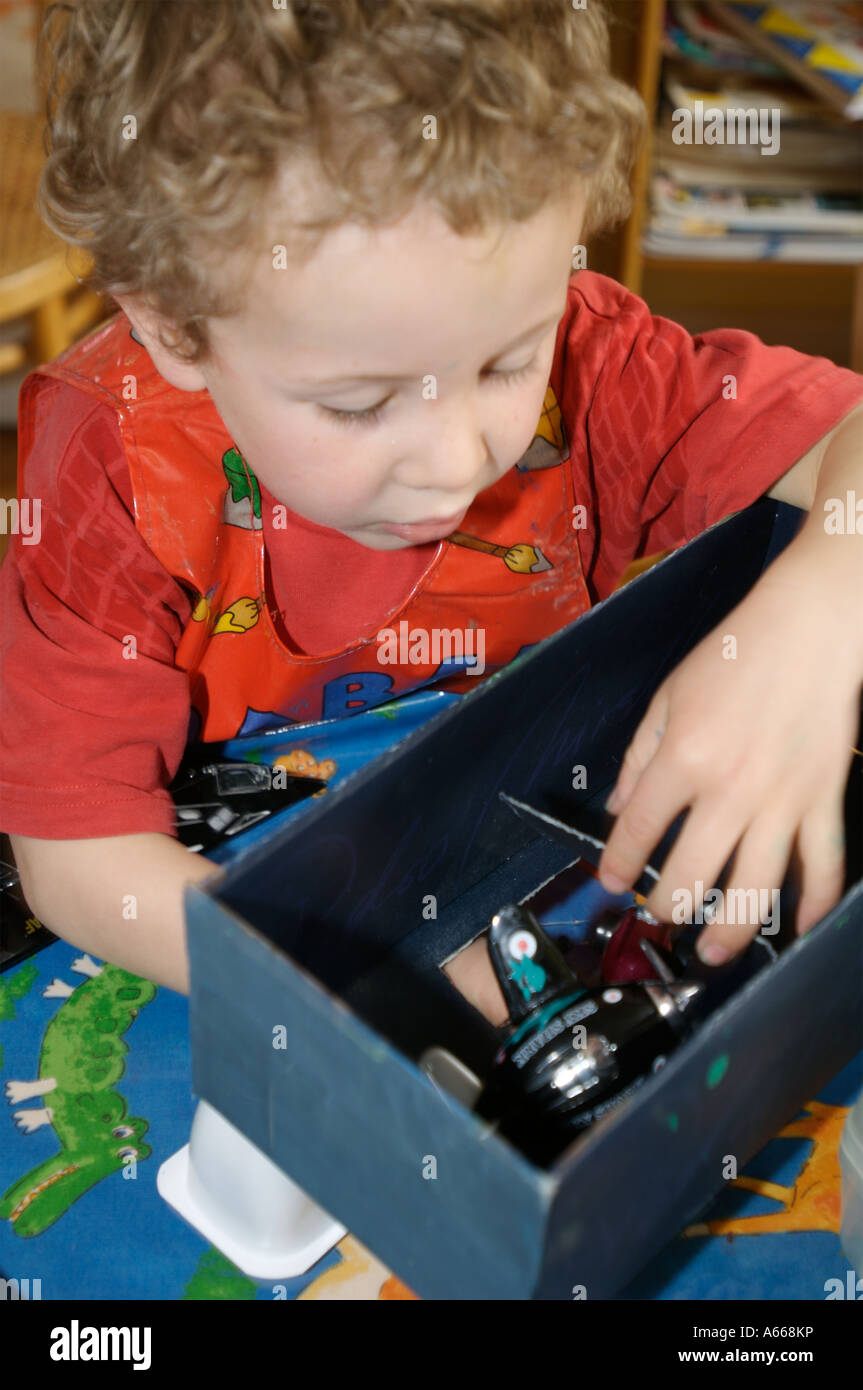 4 yr old boy building rocket Stock Photo - Alamy