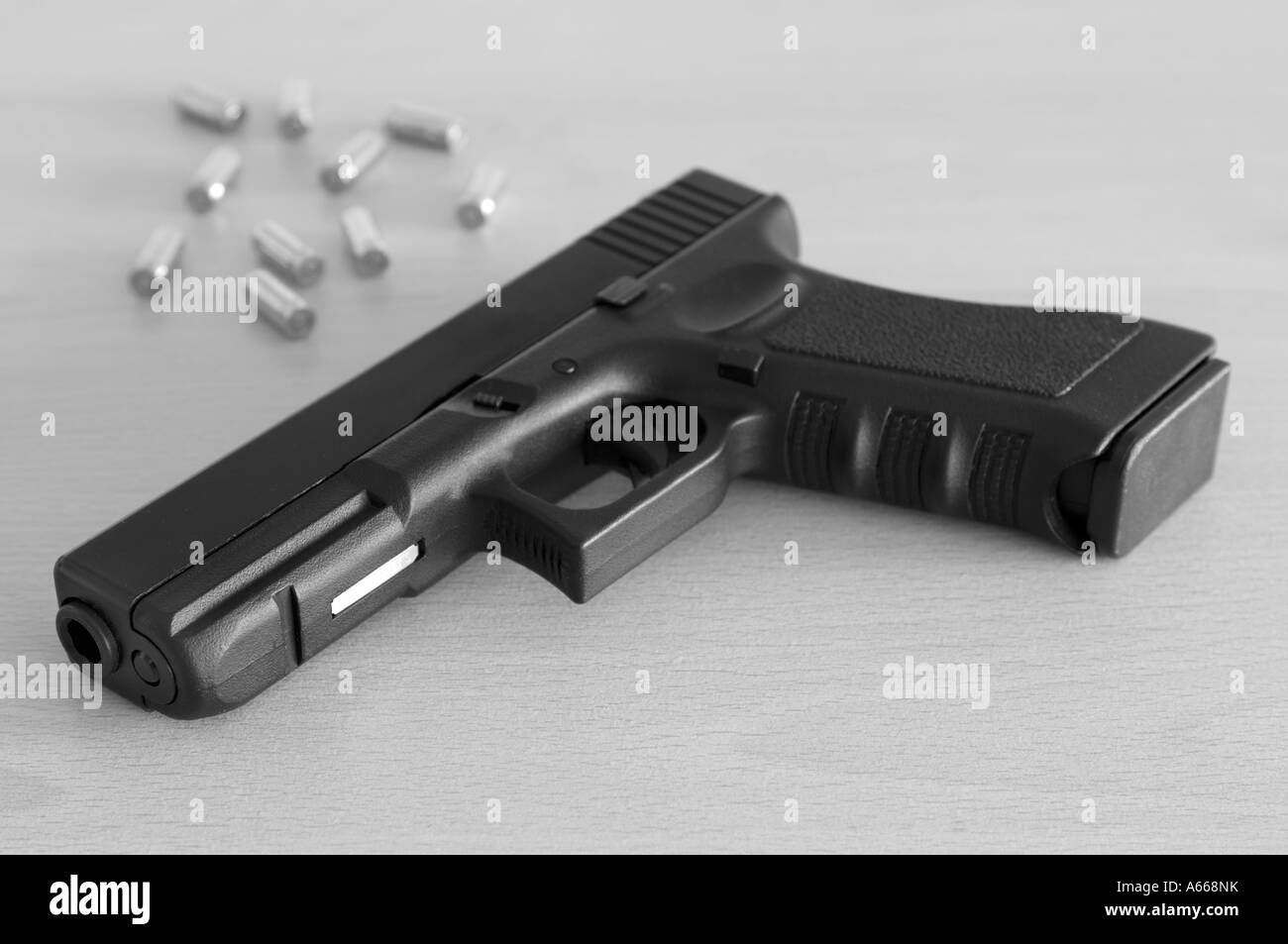 a glock automatic pistol with bullet casings (replica gun Stock Photo ...