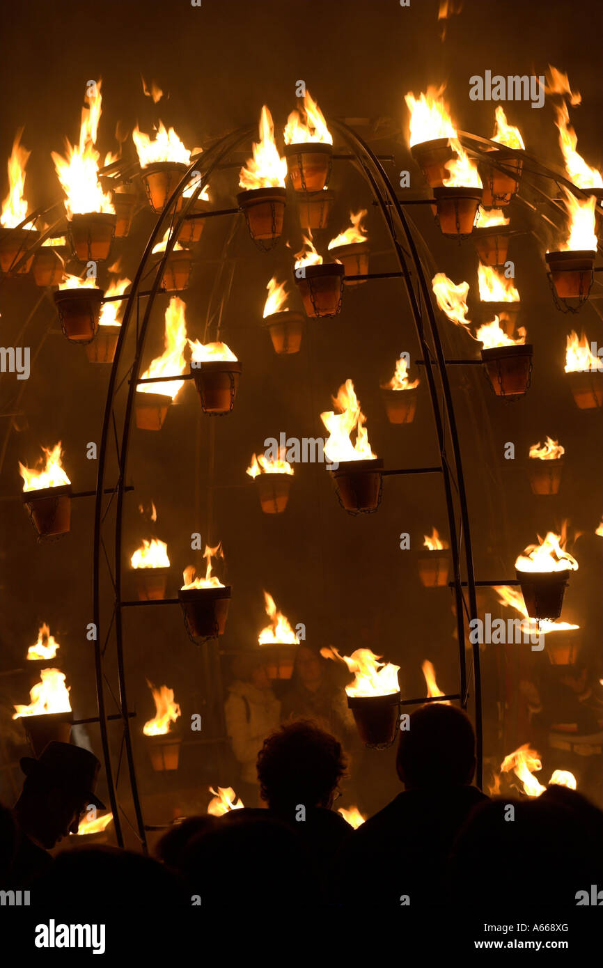 Large [ball of fire], art sculpture made of ceramic fire pots lit at ...