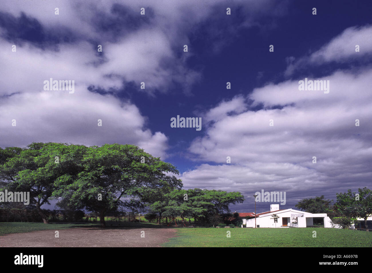 Horizontal view of a single house under a spectacular blue sky and ...