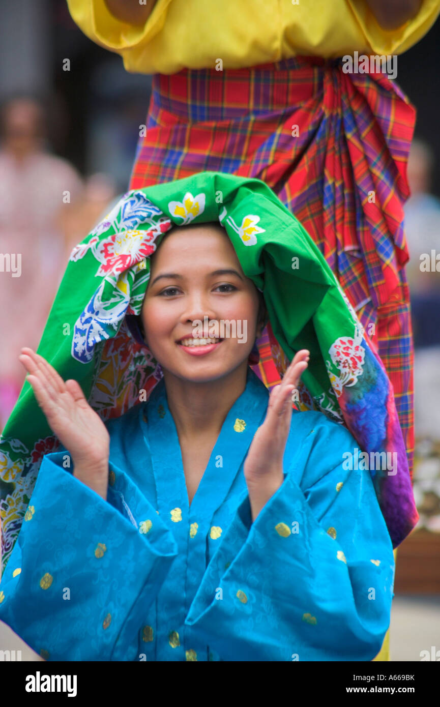 pretty Malaysian girl dancer clapping and smiling during an entertainer ...
