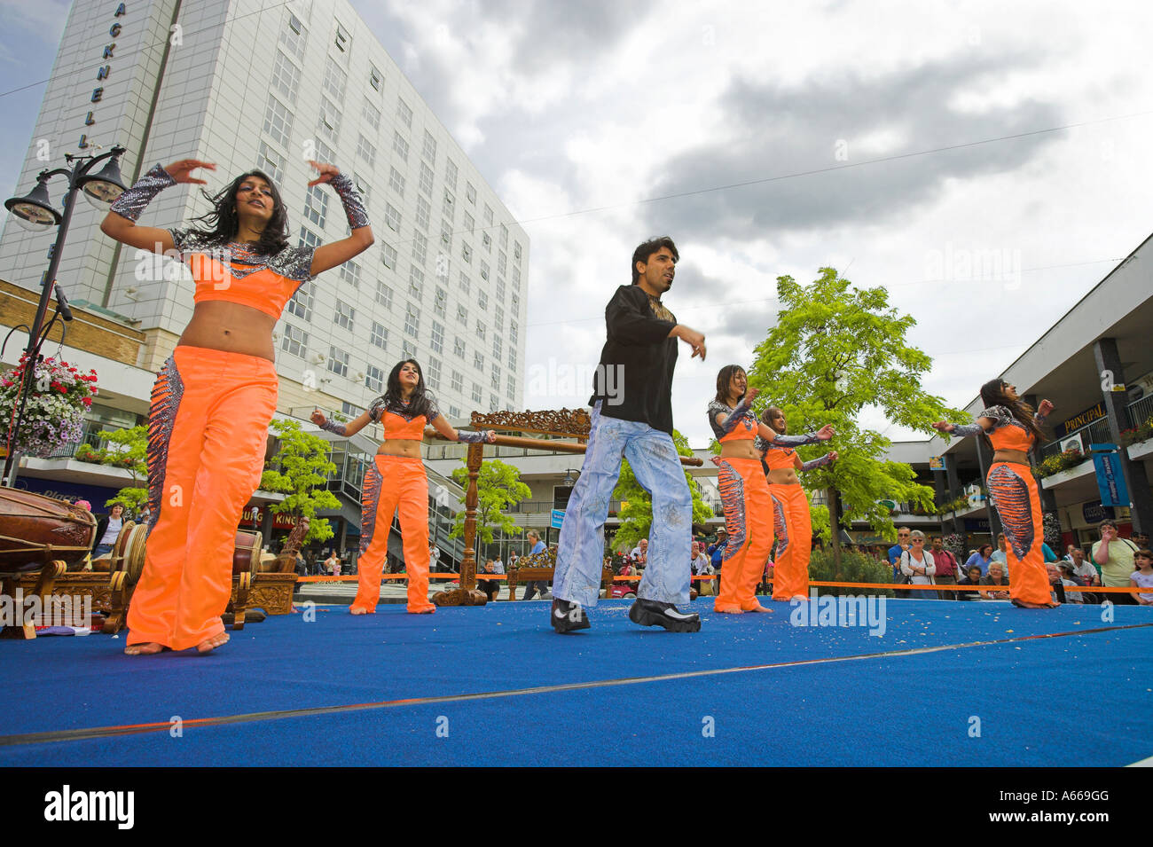 Bollywood Dancers dancing on stage from low level Stock Photo - Alamy