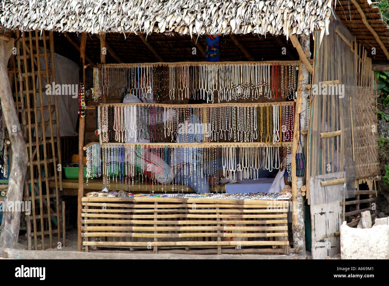 Small souvenir stall selling shell necklaces on the beach on Boracay ...