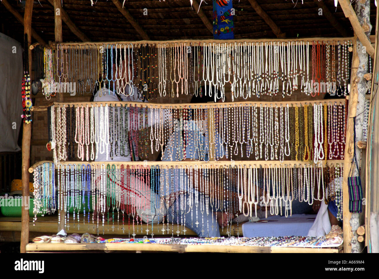 Small souvenir stall selling shell necklaces on the beach on Boracay ...