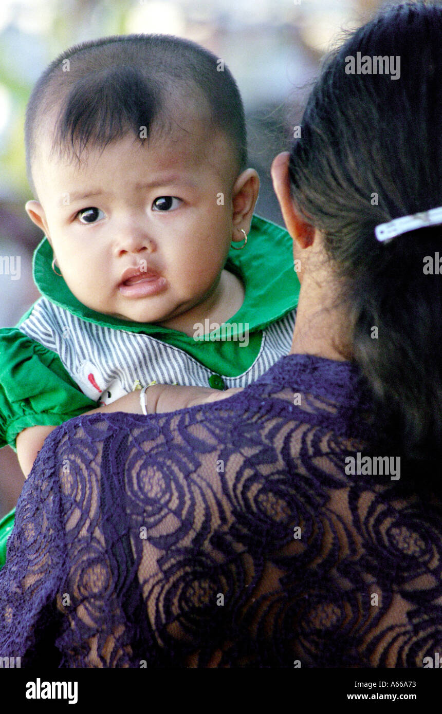 A baby and her mother in Bali Indonesia Stock Photo - Alamy