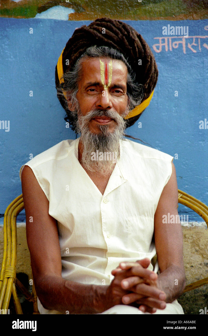Portrait of a holy man sits in front of a temple in Kathmandu in Nepal ...