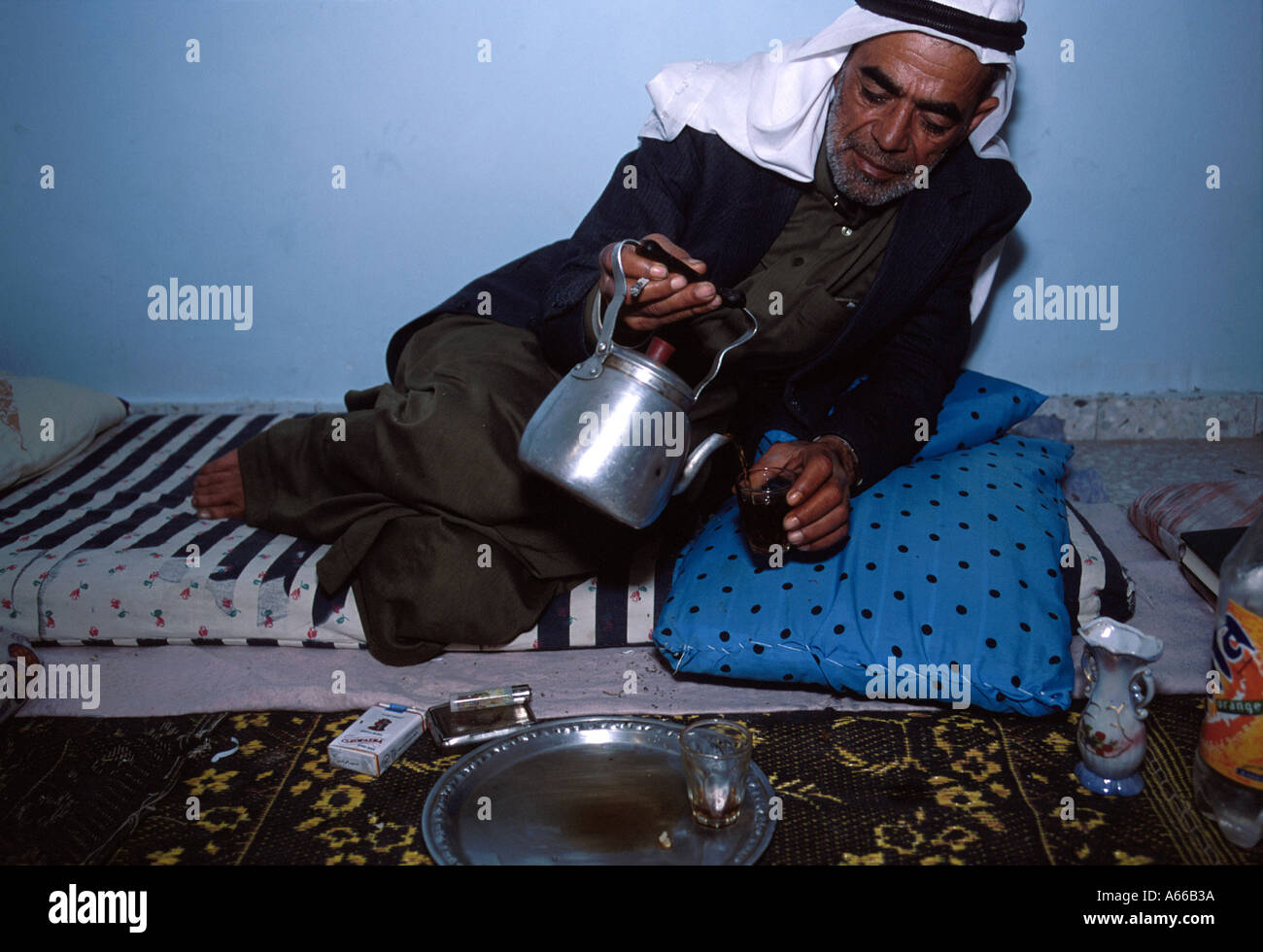 Palestinian man pouring tea at his home in Rafah Gaza strip Stock Photo ...