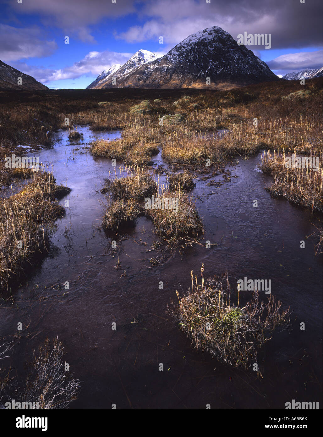 Ice covered pools on Rannoch moor with a view to Buachaille Etive Mor ...