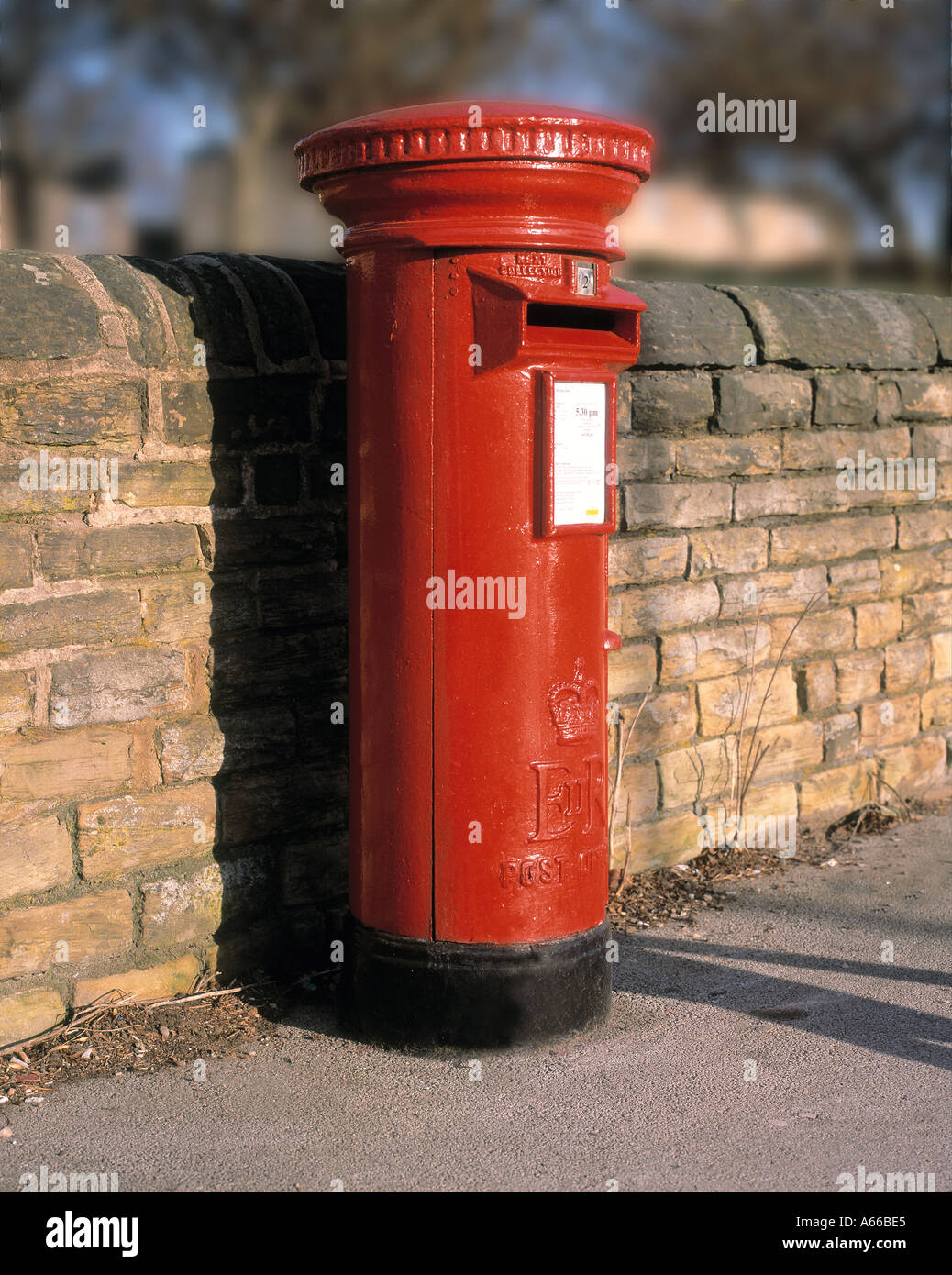RED PILLAR BOX WITH STONE WALL Stock Photo - Alamy