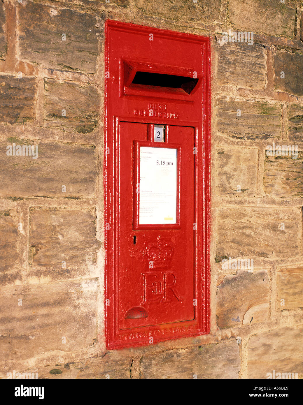 RED POST BOX IN STONE WALL Stock Photo - Alamy