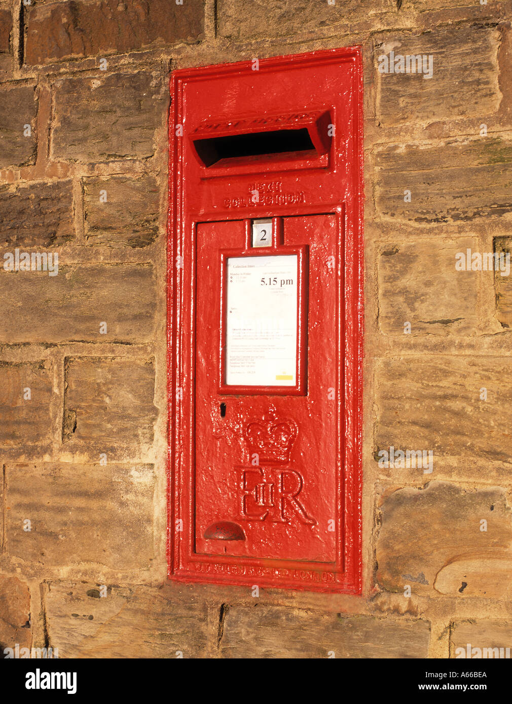 RED POST BOX IN STONE WALL Stock Photo - Alamy