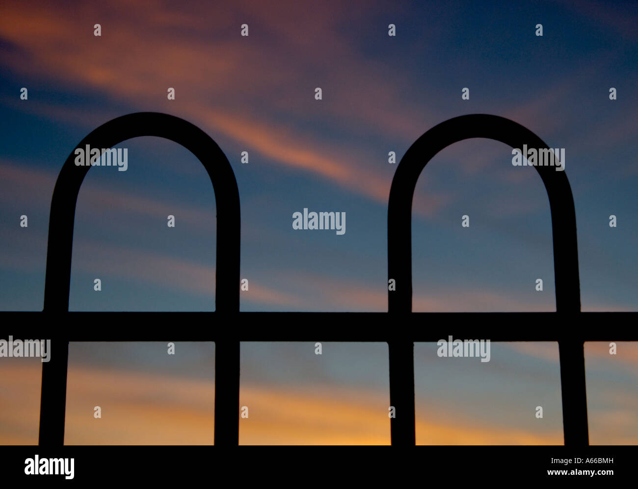 silhouettes of metal railings on a kids playground in the uk Stock ...