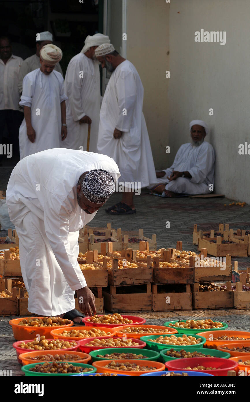 Man buying dates at the market in Muscat, Oman Stock Photo - Alamy