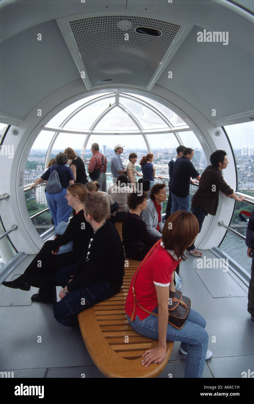 some people relaxing look out of a pod on the london eye uk Stock Photo ...