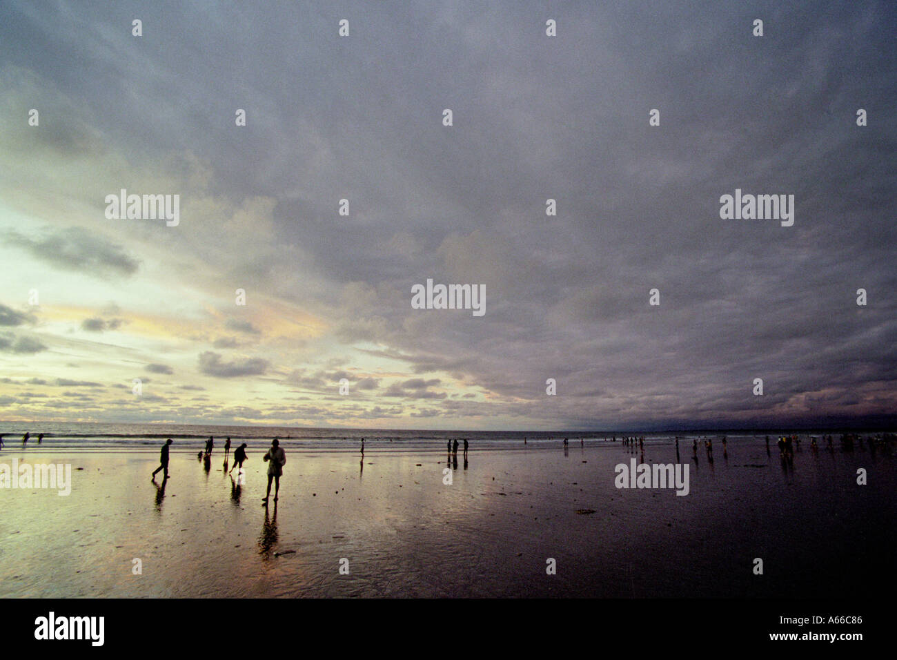 Sunset a Kuta beach in Bali Indonesia Stock Photo - Alamy