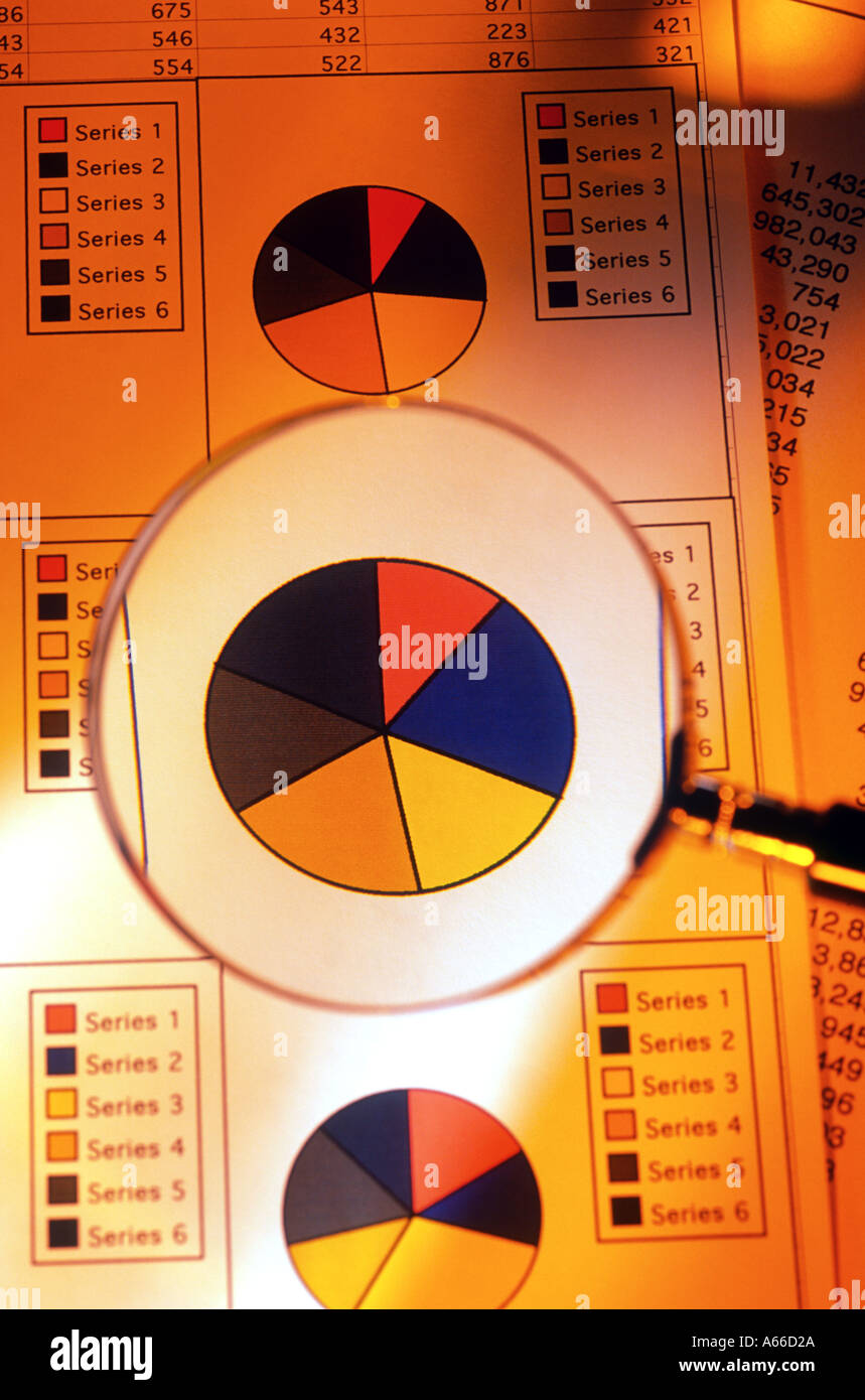 Pie chart through a magnifying glass Stock Photo - Alamy