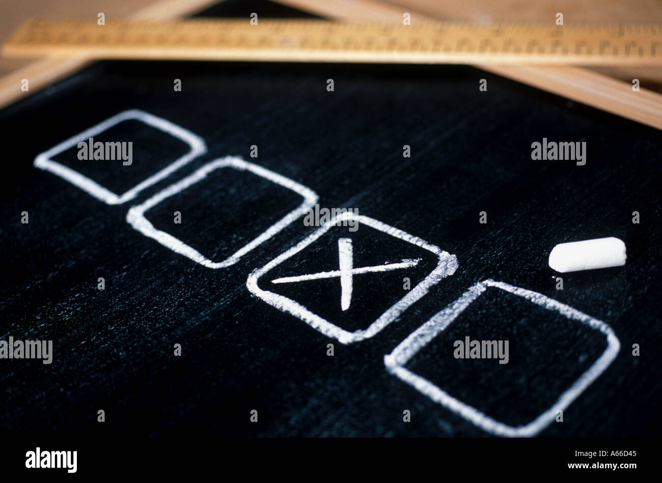 Voting Drawing a cross in a box on a school slate Stock Photo - Alamy