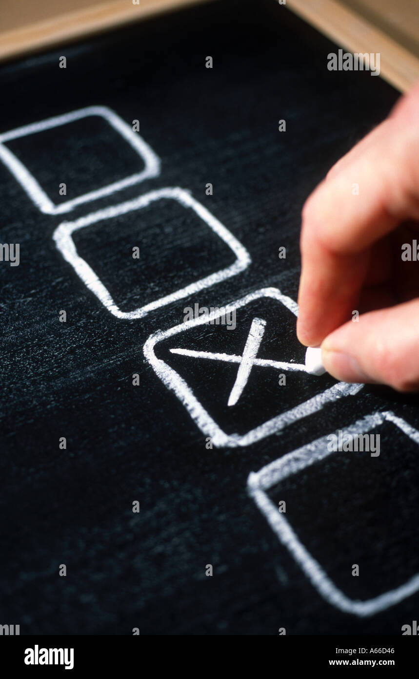 Voting drawing a cross in a box on a school slate Stock Photo - Alamy