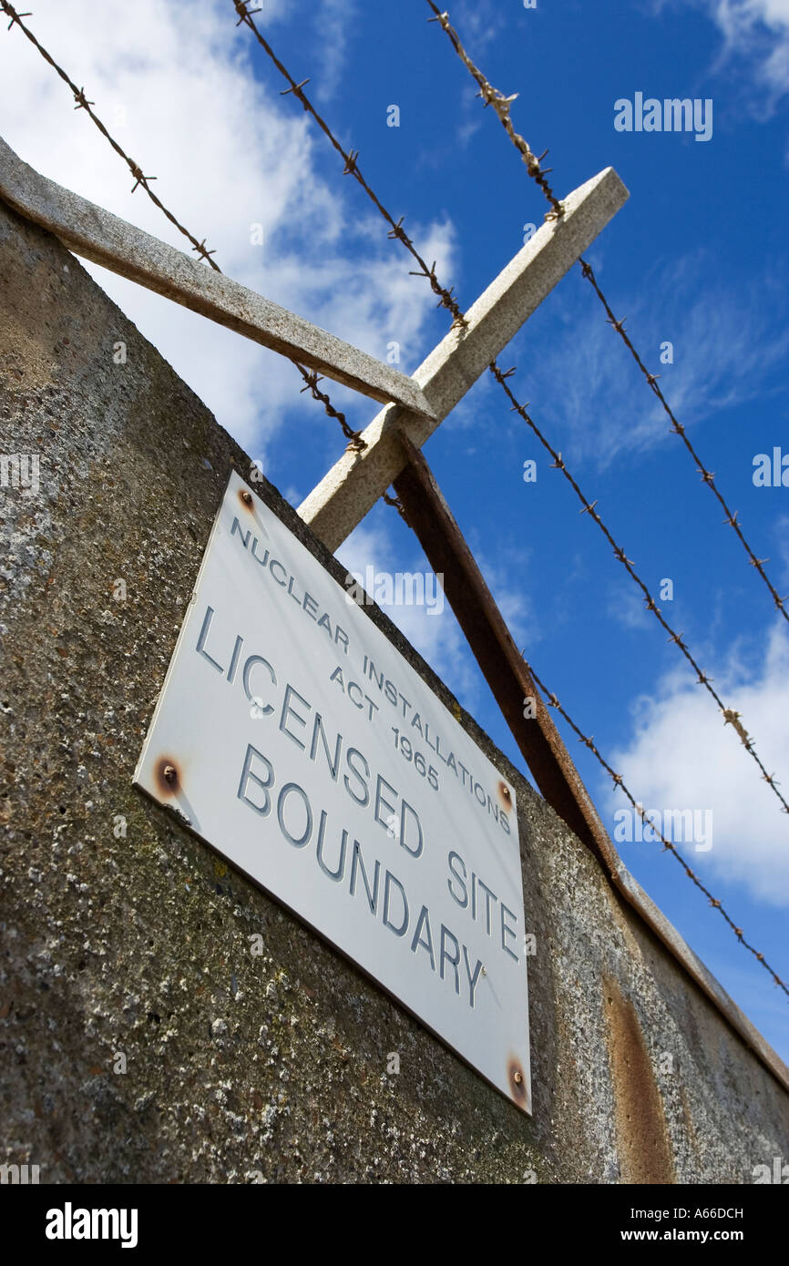 Nuclear installation sign on boundary wall against blue sky Stock Photo ...