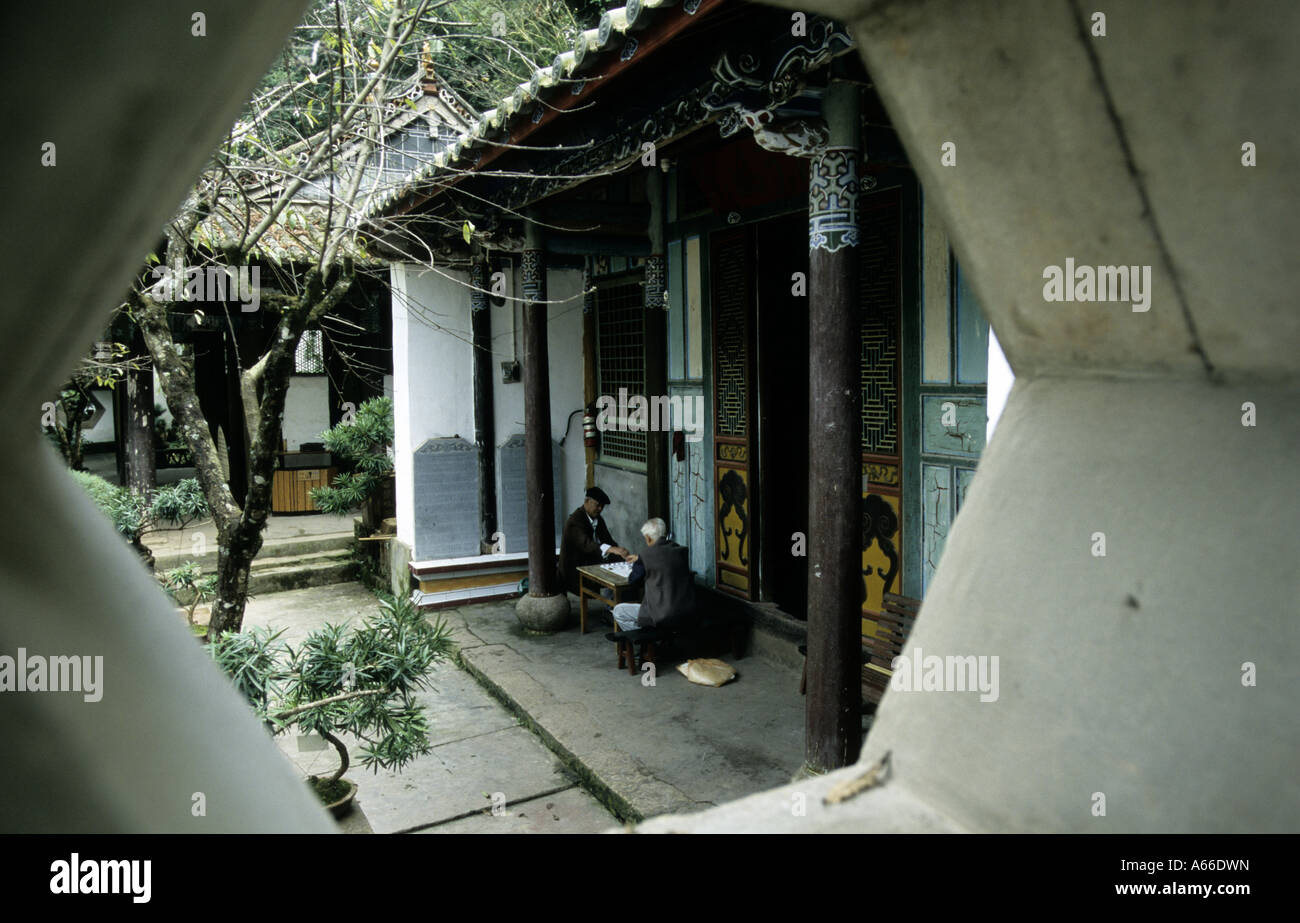View through hexagonal window on a patio of a temple in the Xiu Shan ...