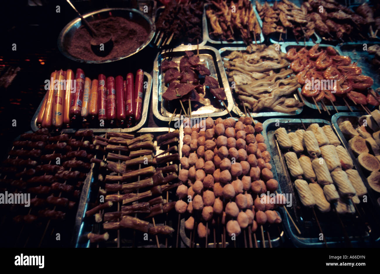 Meat snacks on a grill. Tonghai, Yunnan, China Stock Photo - Alamy