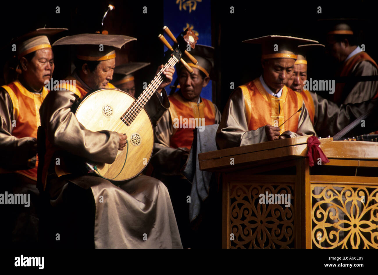 Musicians in traditional dress playing classical Chinese instruments in ...