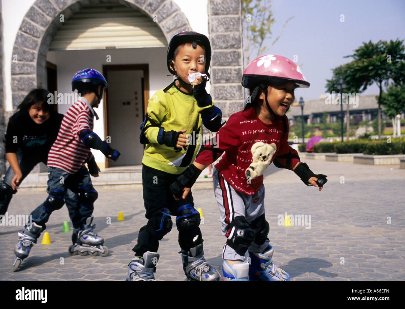 Children learning roller skating in Jianshui, China Stock Photo - Alamy