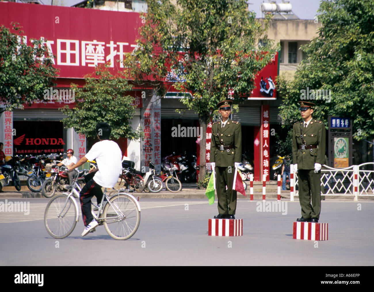 Two police officers standing in stiff posture on a crossing, waiting ...