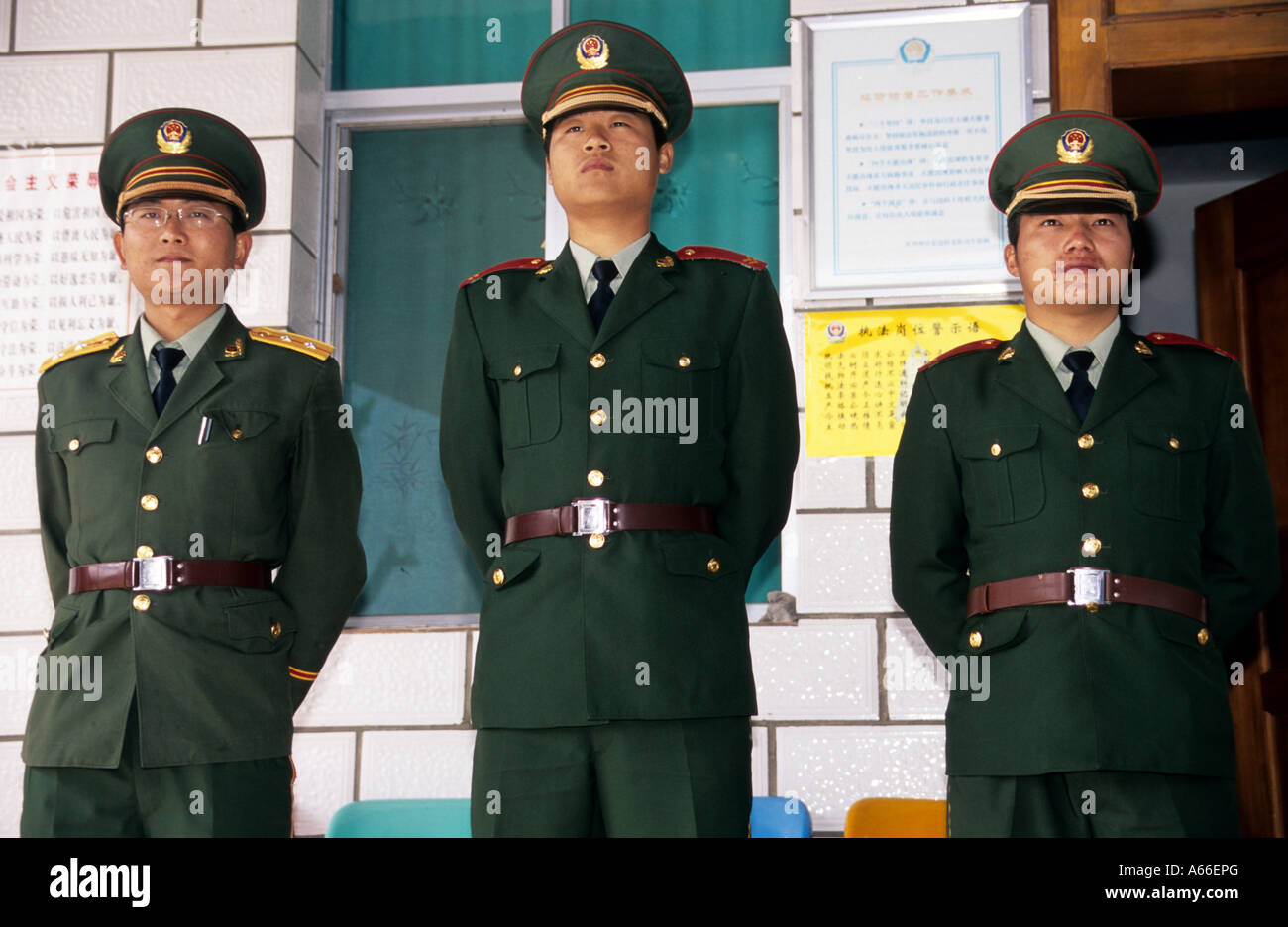 Three police officers manning a check point along the road to Luchung ...