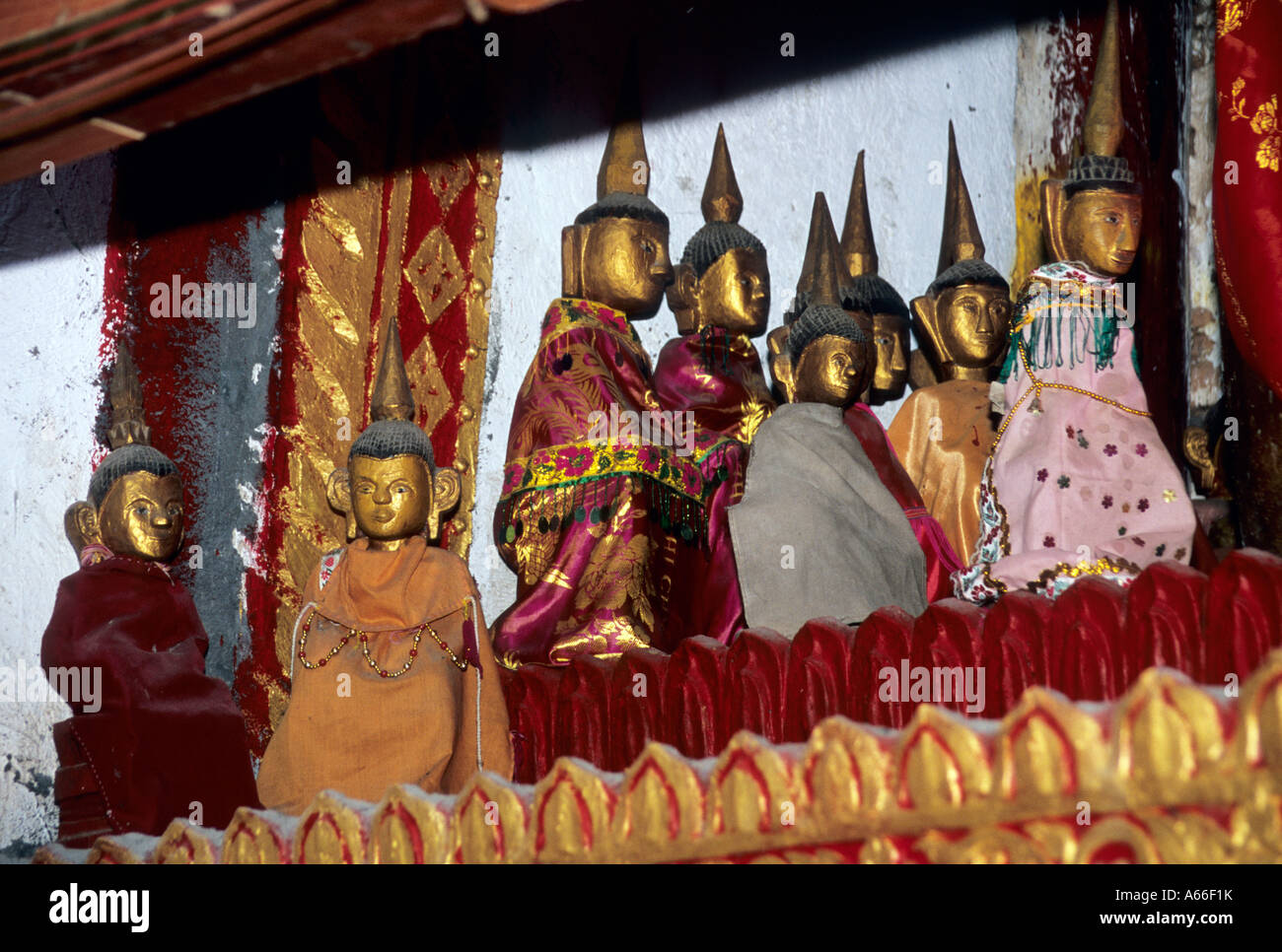 Small buddhist statues in the local temple of the Bulang village of ...