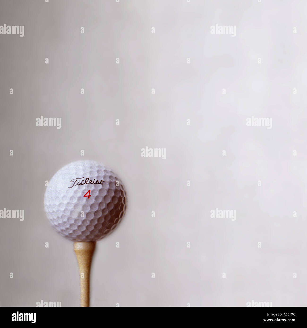 colour image off a single golf ball standing on its tee shot in the ...