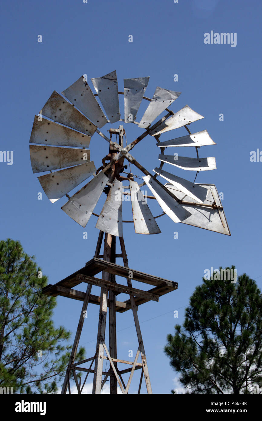 SILVER WINDMILL AGAINST A BLUE SKY BAPDb10322 VERTICAL Stock Photo - Alamy