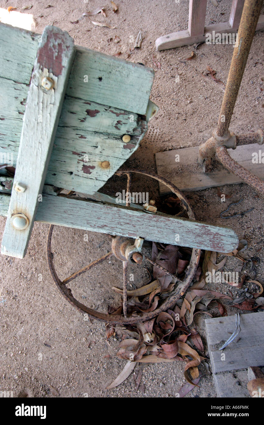 SIDE VIEW OF OLD TIMBER AND IRON WHEELBARROW VERTICAL BDB10388 Stock ...