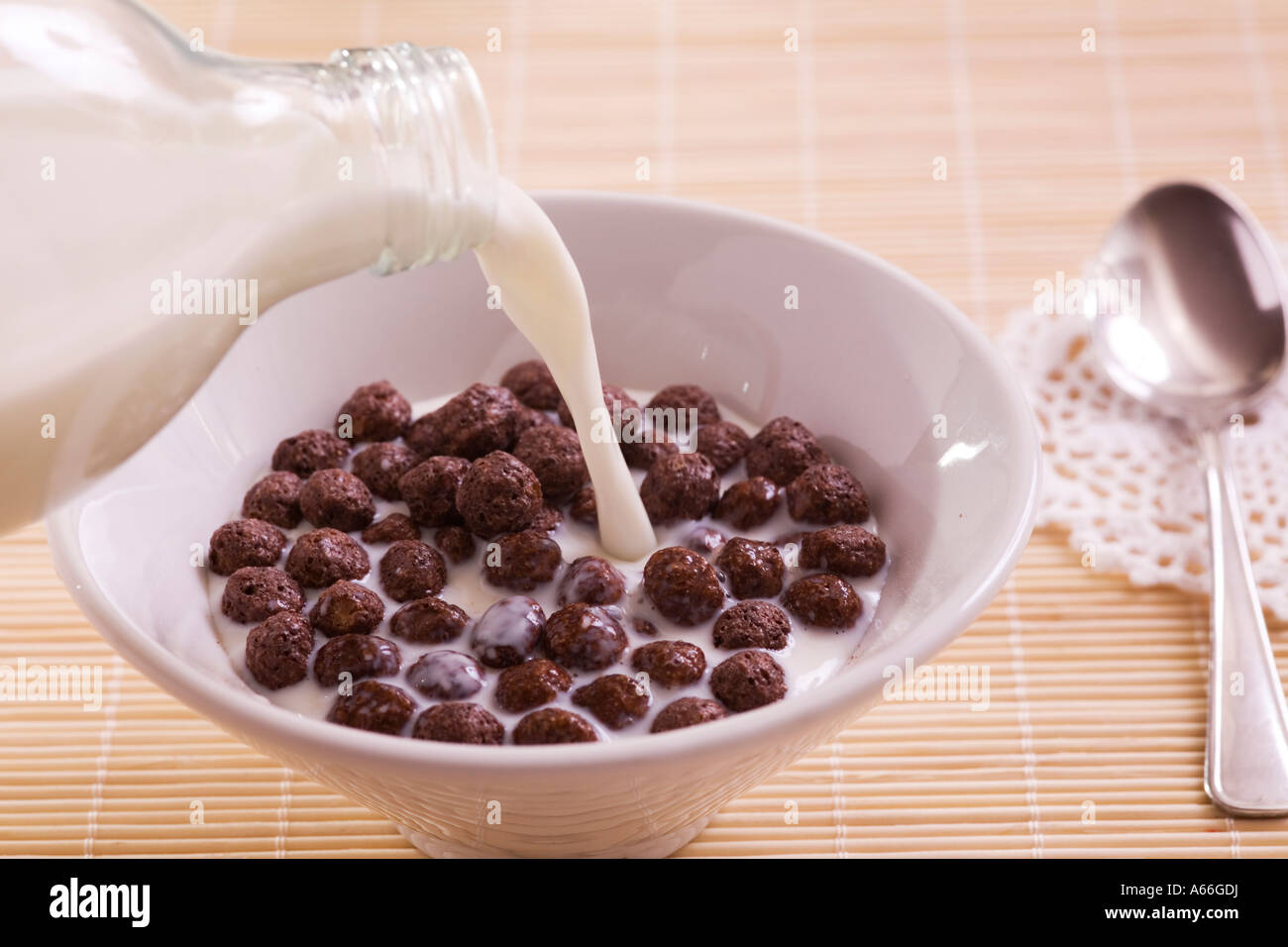 Chocolate rice crispy with milk being poured Stock Photo - Alamy