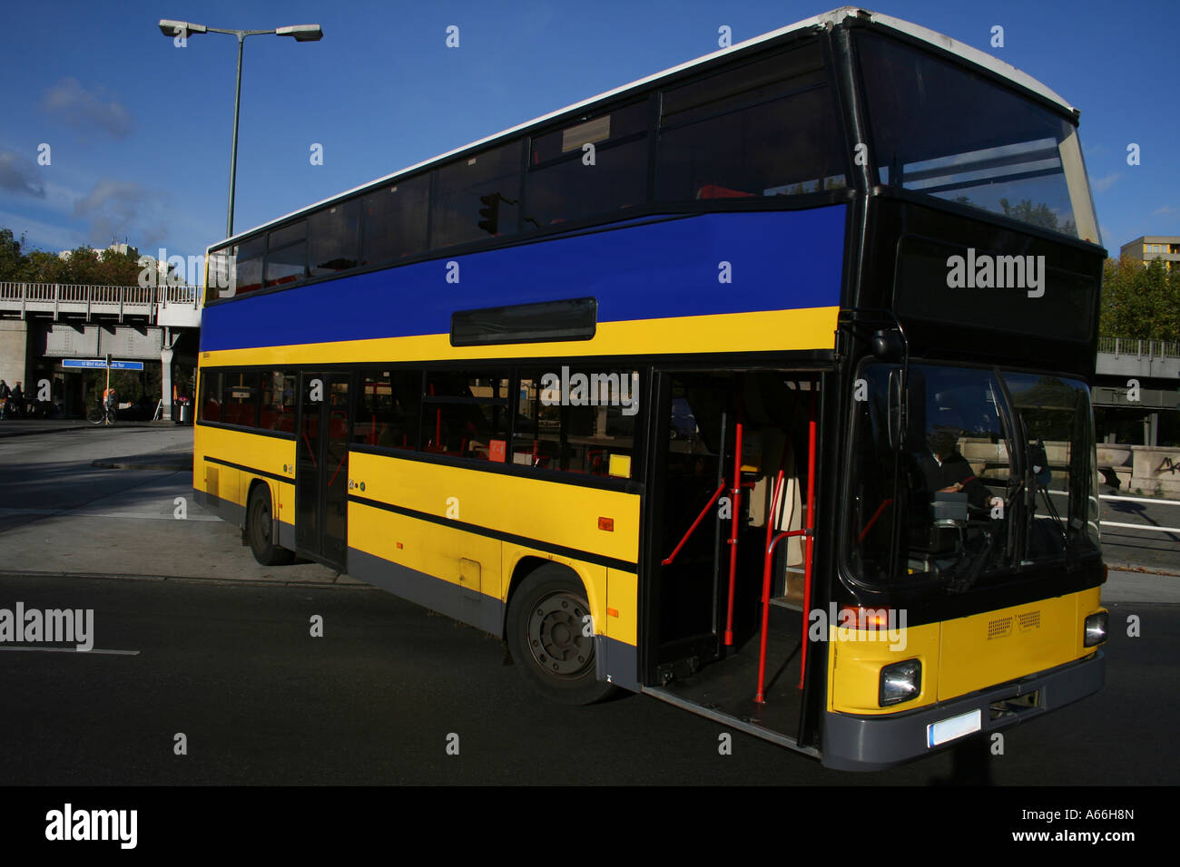 yellow city bus on the road Stock Photo - Alamy
