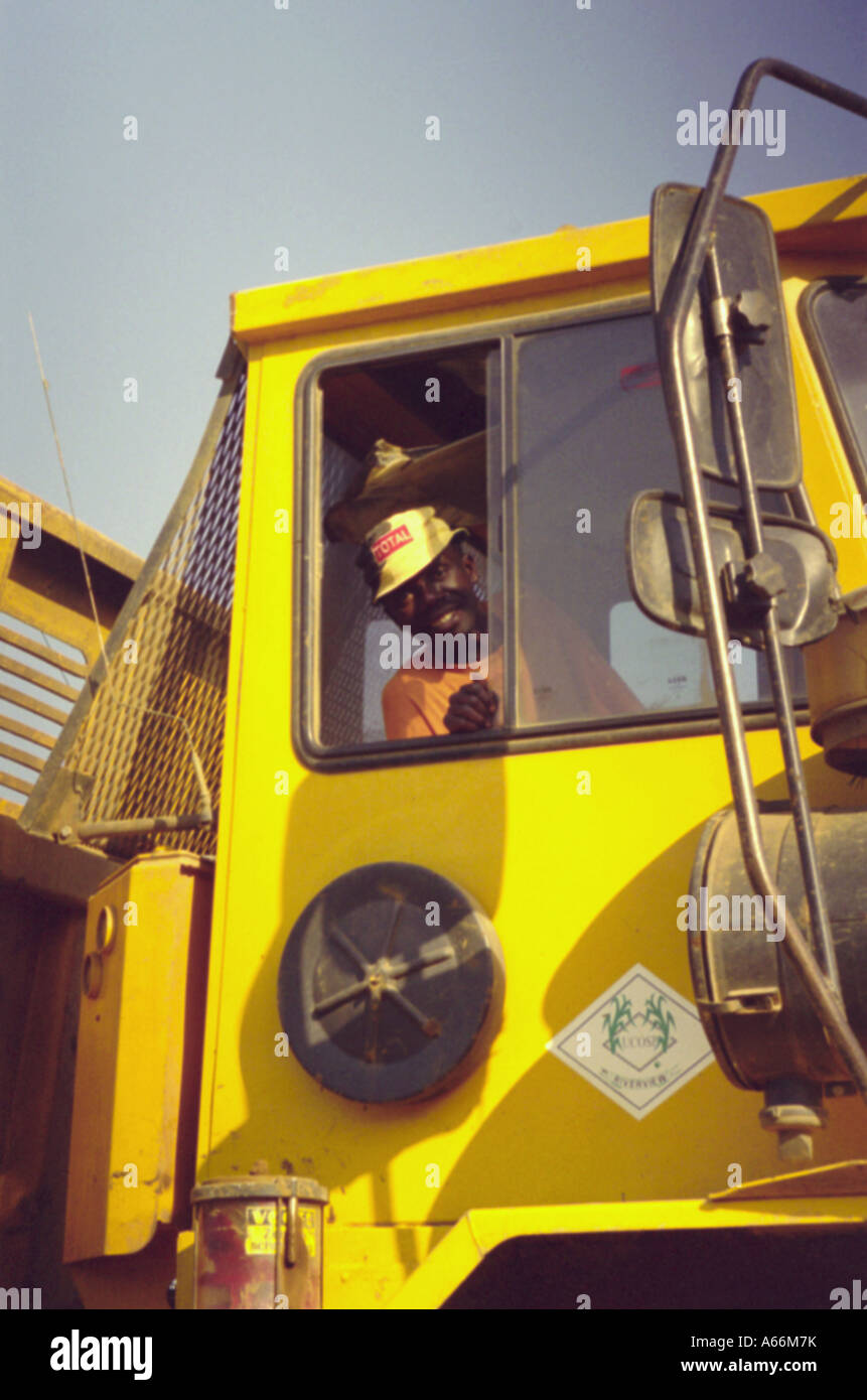 Smiling black male truck driver Looks down from the cab window of his ...