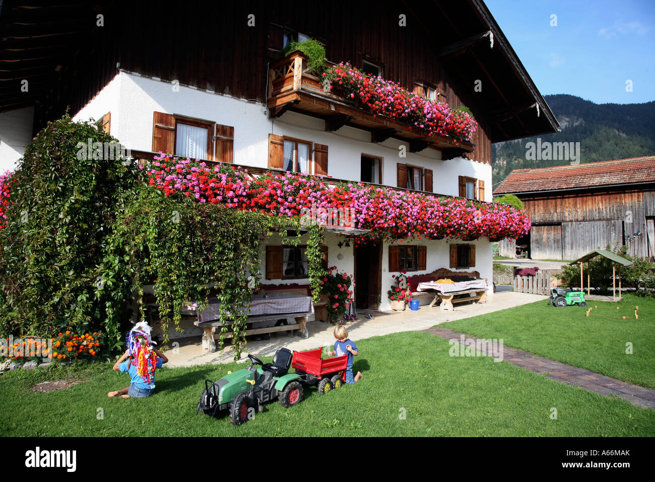 Children playing on a traditional dairy farm in Bavaria Germany Stock ...