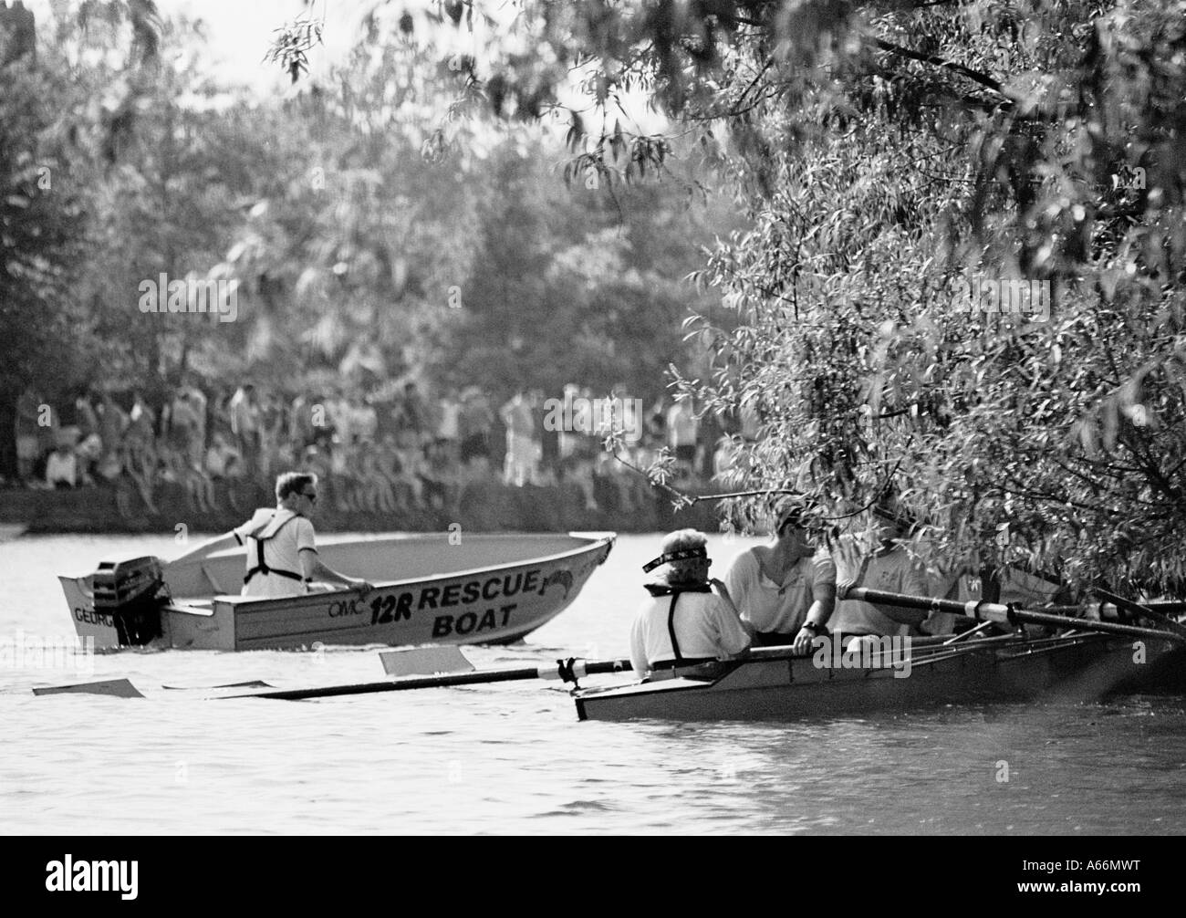 Rescue boat comes to help a bumped long boat that crashed into a willow ...