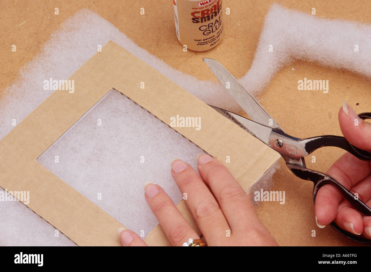 Close-up of hands cutting nylon padding Stock Photo - Alamy
