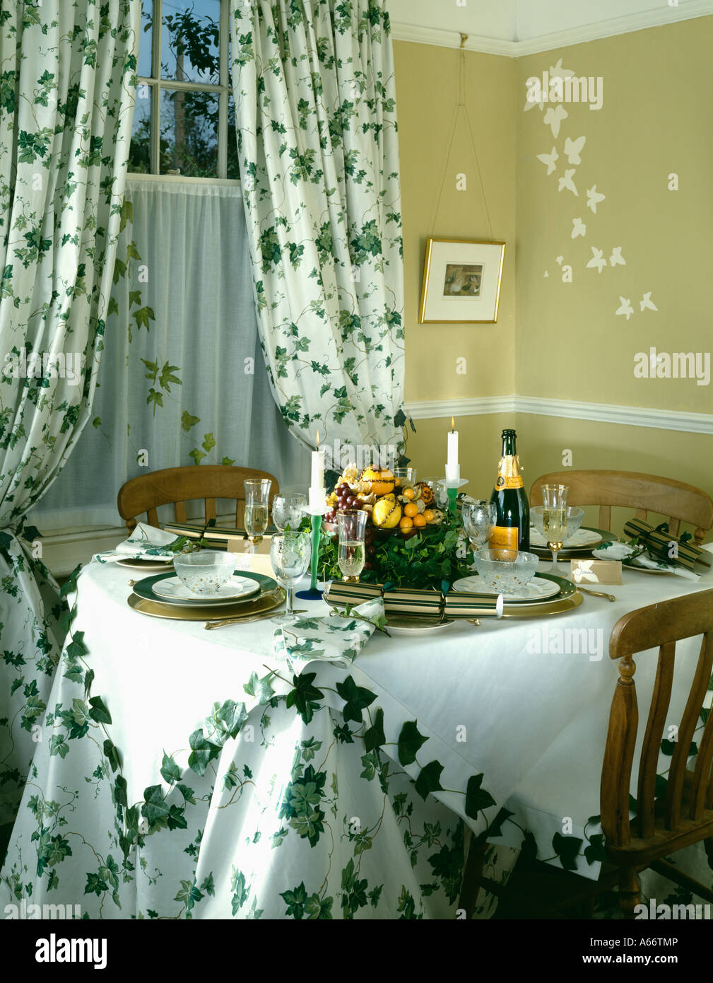 Dining table set for celebration dinner with white tablecloth decorated ...