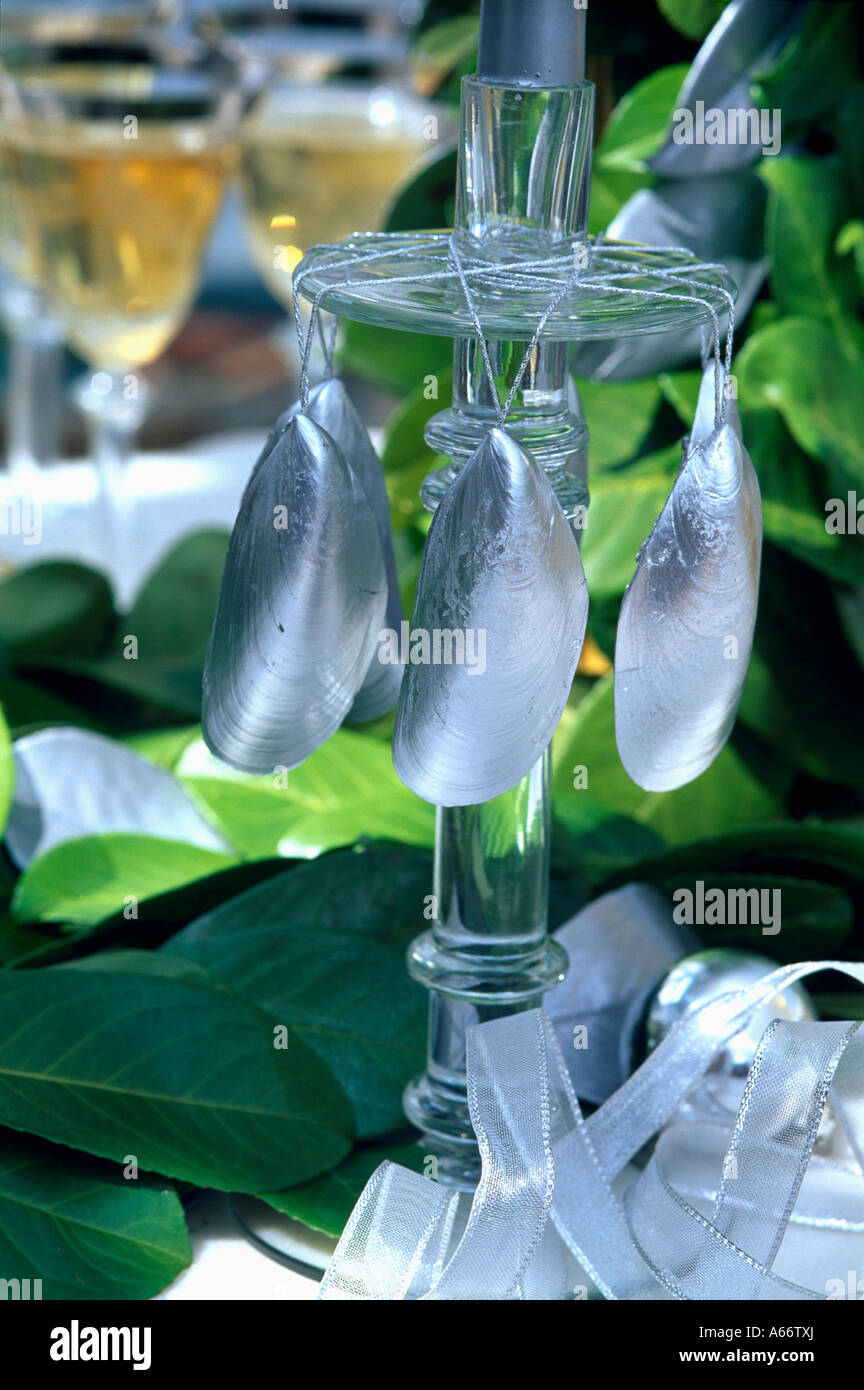 Glass candlestick decorated with metallic painted mussel shells Stock ...