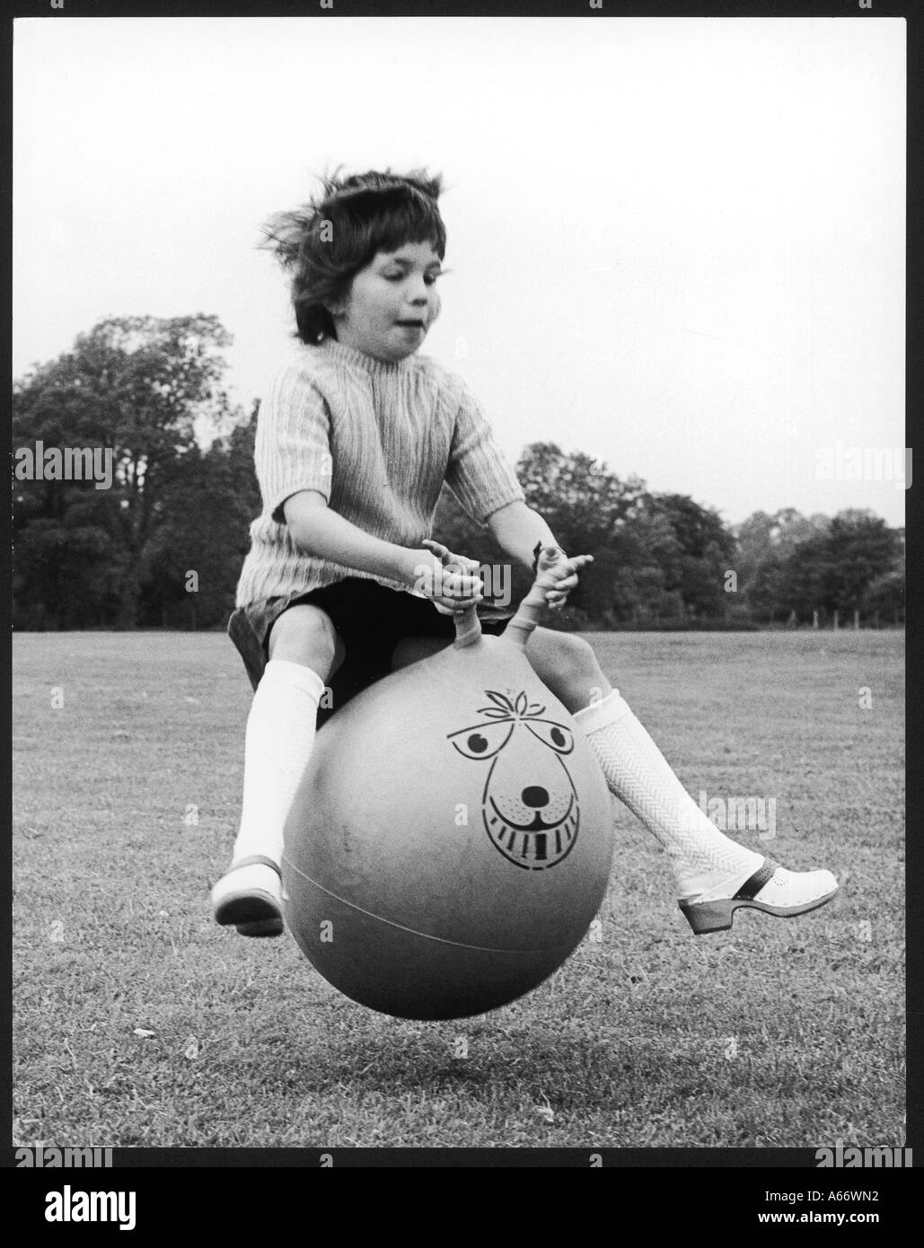 Girl On Spacehopper 1of3 Stock Photo - Alamy