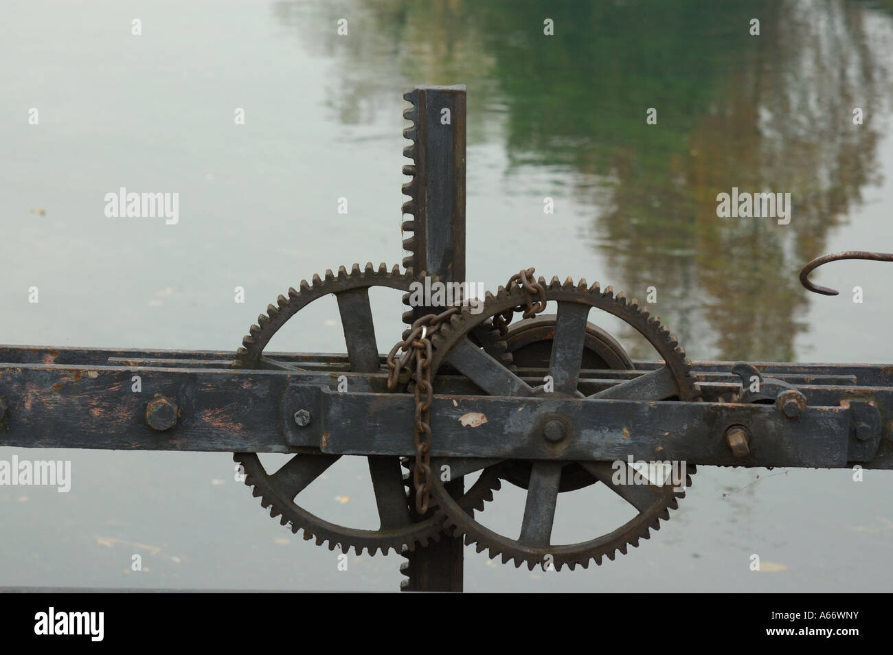 Old wheels of the mechanism of a dam of a river Stock Photo - Alamy