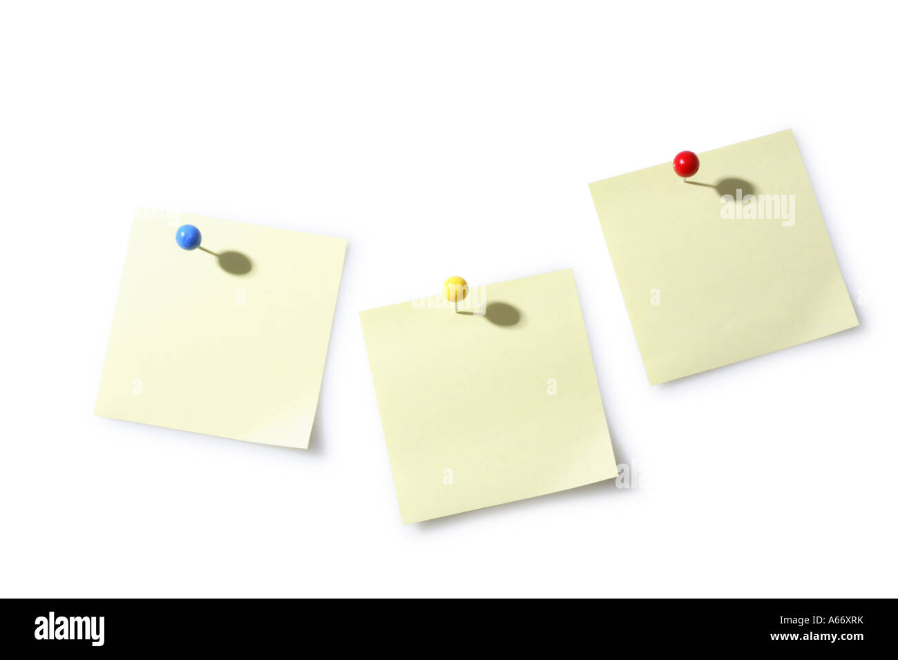 Three yellow notes cut out on white background Stock Photo - Alamy