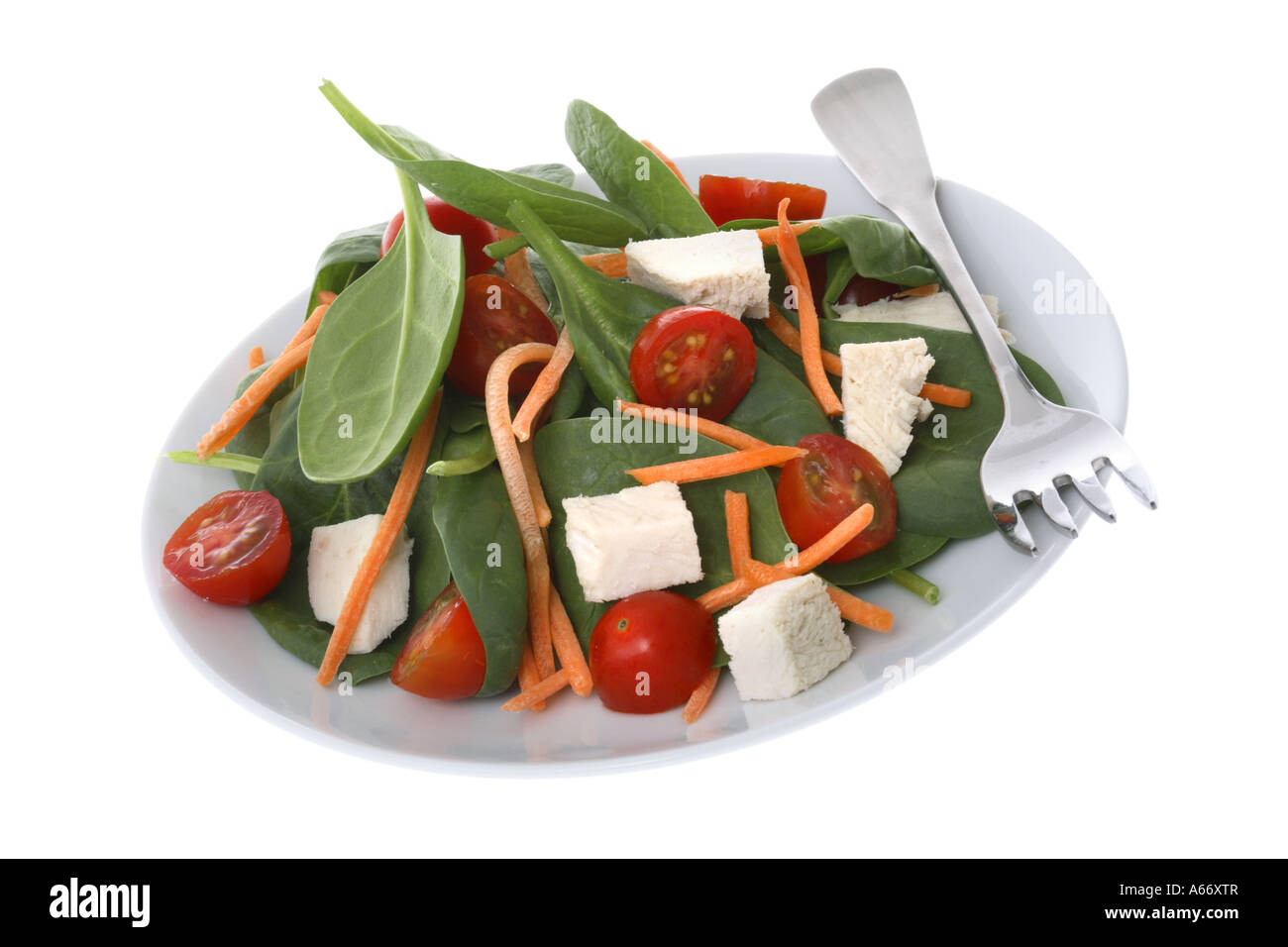 Spinach salad cut out on white background Stock Photo - Alamy